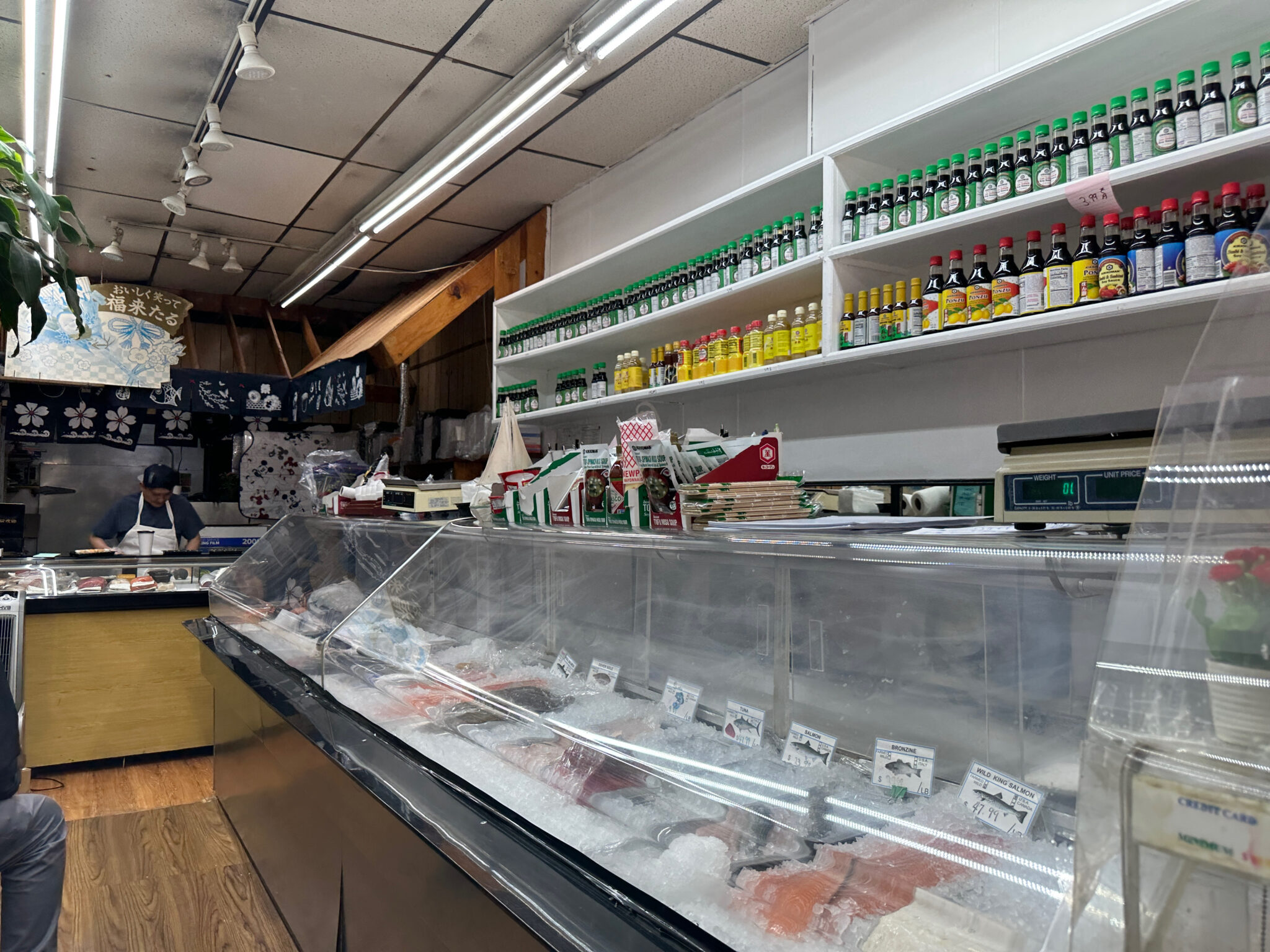 A fish market with a sushi counter | Roy's