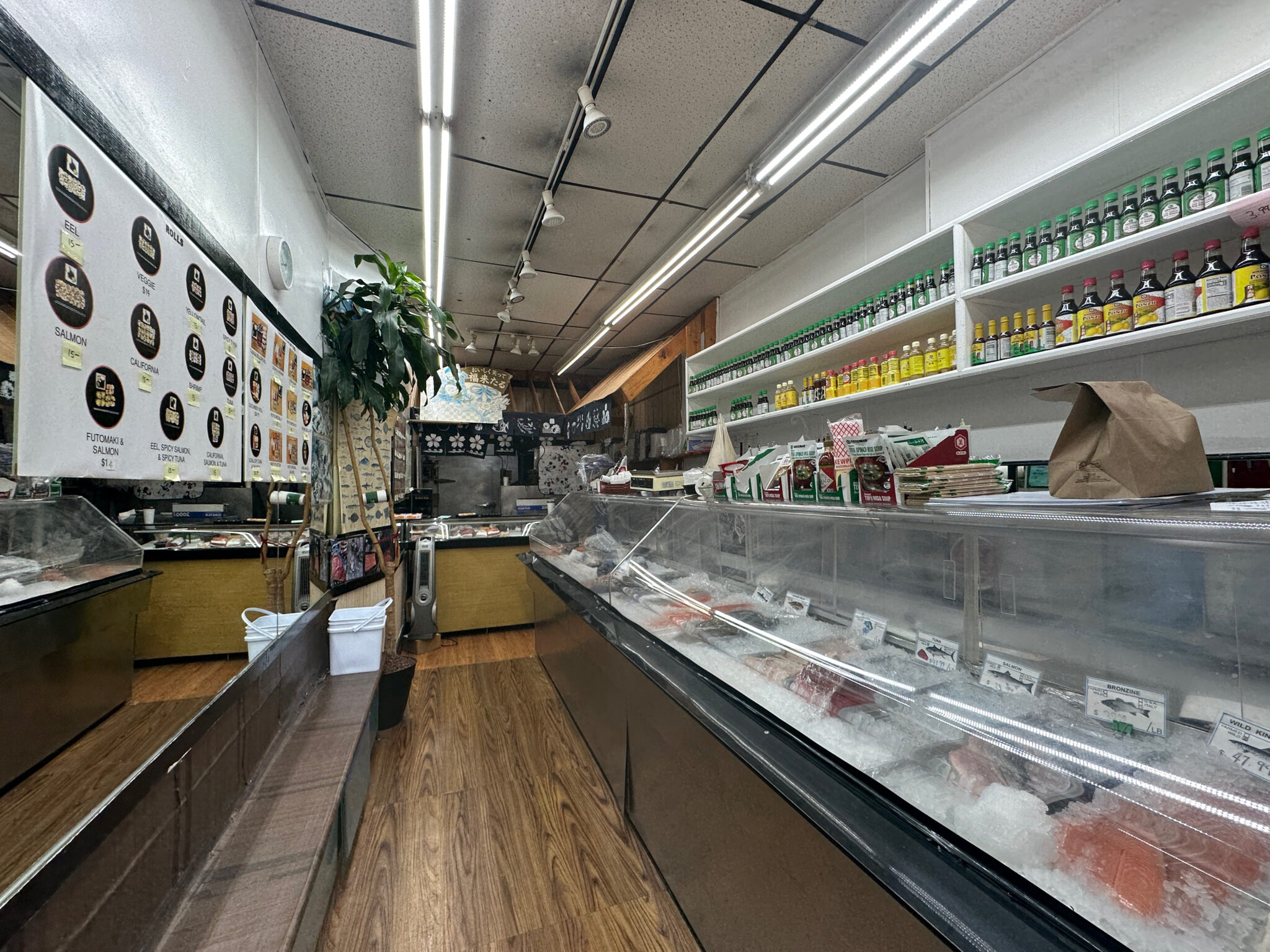 A fish market with a sushi counter | Roy's